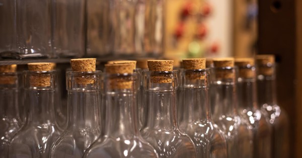 closeup-empty-glass-bottles-with-corks-blurred-background-600x315w.jpg